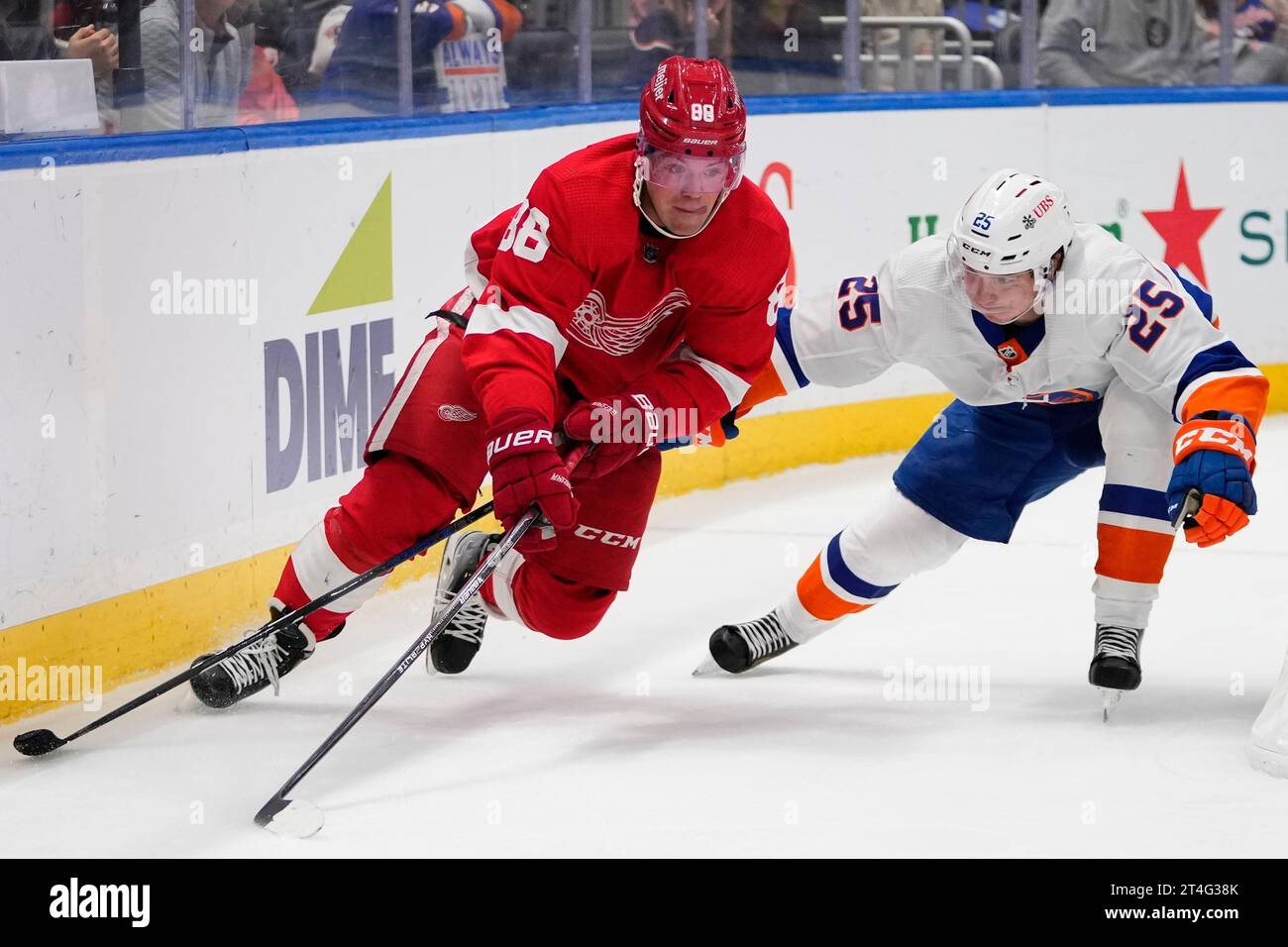 Detroit Red Wings' Daniel Sprong (88) fights for control of the puck ...