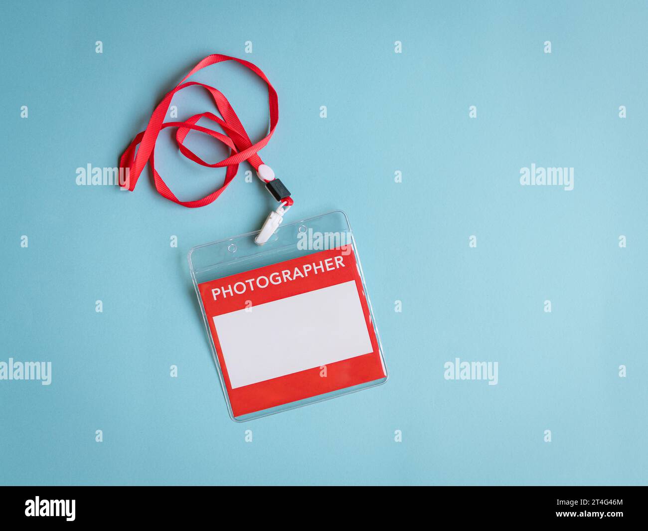 Photographer lanyard on blue background Stock Photo - Alamy