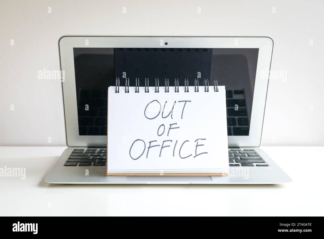 Out of office, written message on top of computer laptop Stock Photo ...