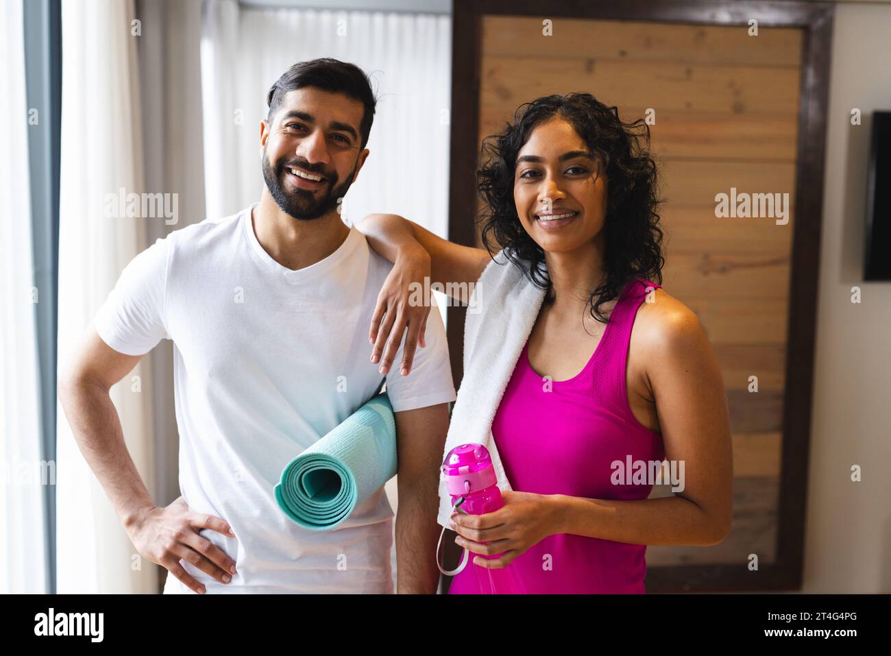 Happy biracial couple standing in hi-res stock photography and images ...