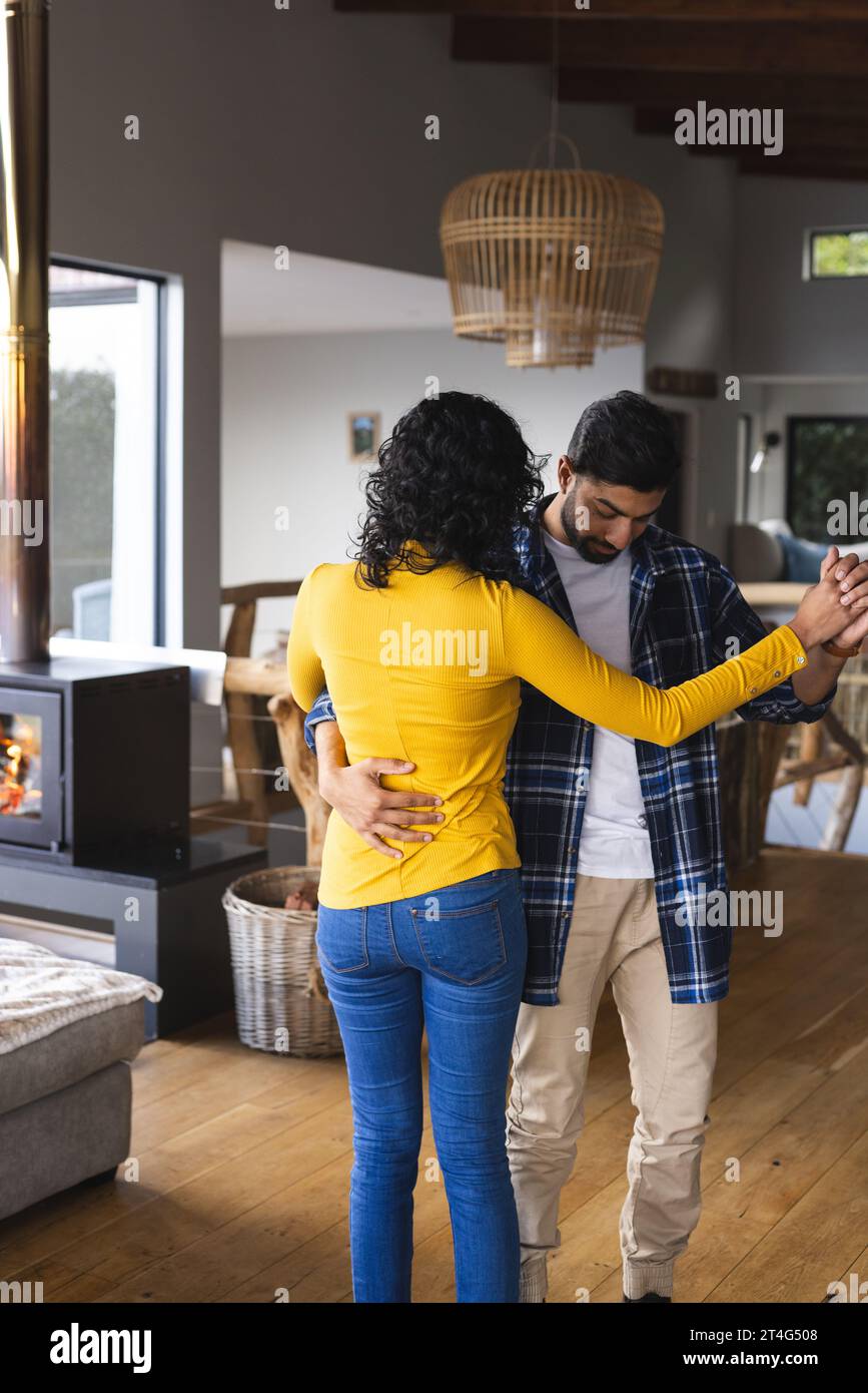 Happy biracial couple in living hi-res stock photography and images - Alamy