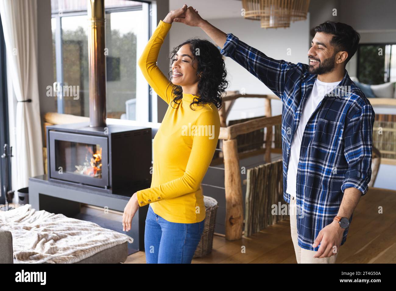 Happy biracial couple in living hi-res stock photography and images - Alamy