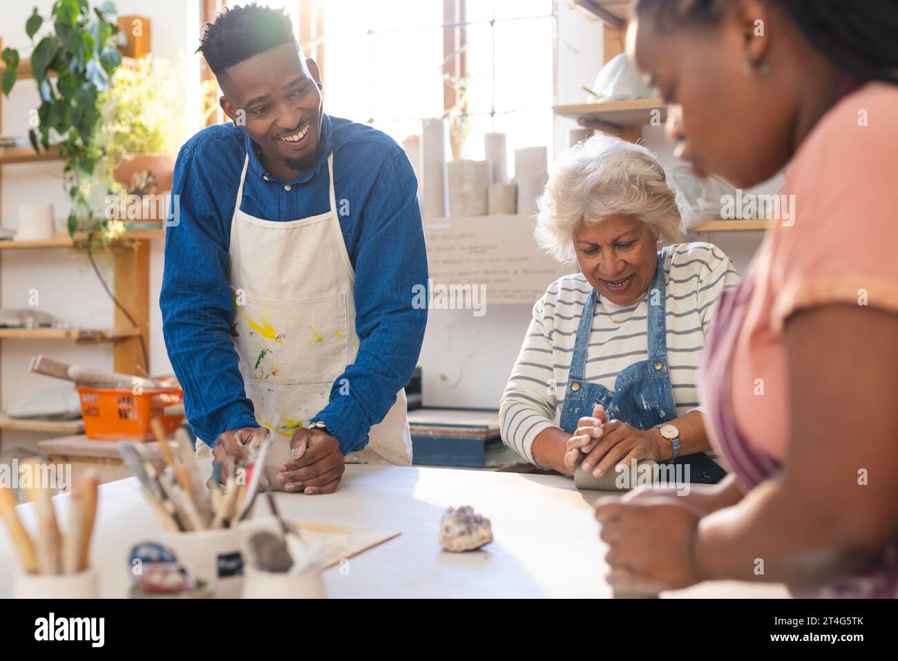 Happy diverse group potters shaping hi-res stock photography and images ...