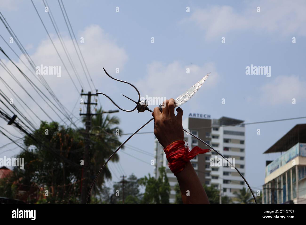 Shoola kaavadi during Navaratri festival in Poojappura Stock Photo - Alamy