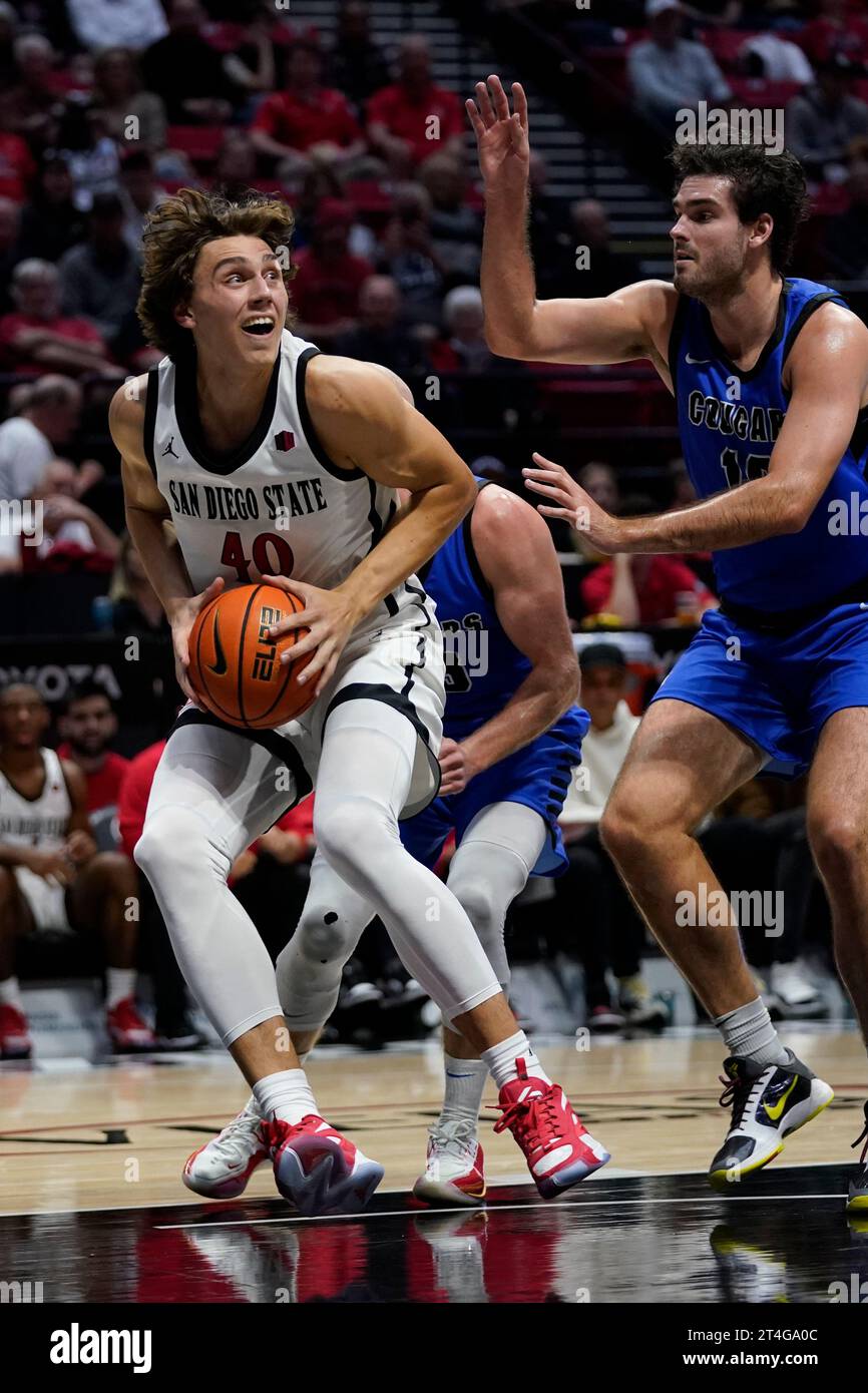 San Diego State forward Miles Heide, left, looks to shoot as Cal State ...