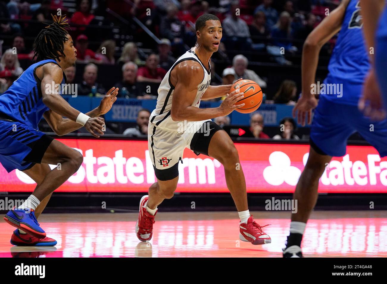 San Diego State forward Jaedon LeDee, center, dribbles the ball during ...