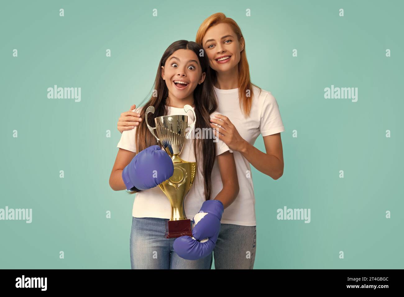 Strong family, girl power. Sportive young woman and her daughter ...