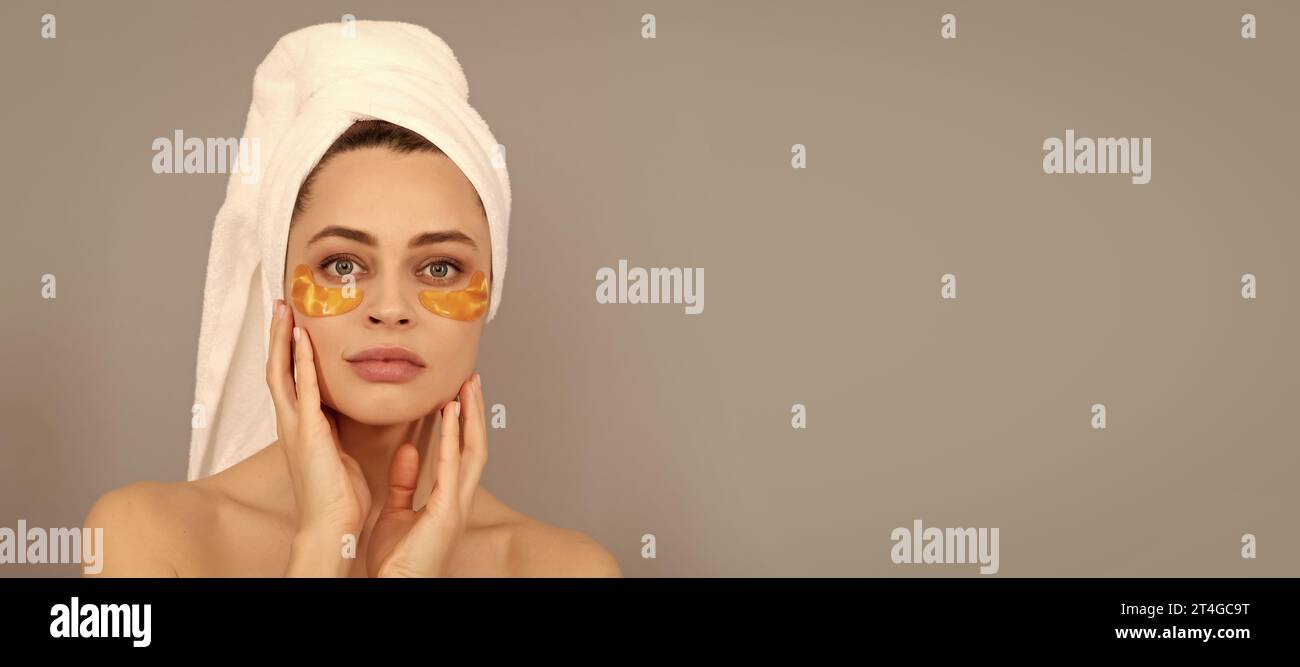 Eye patches, patch under eyes. beautiful girl with terry towel use ...