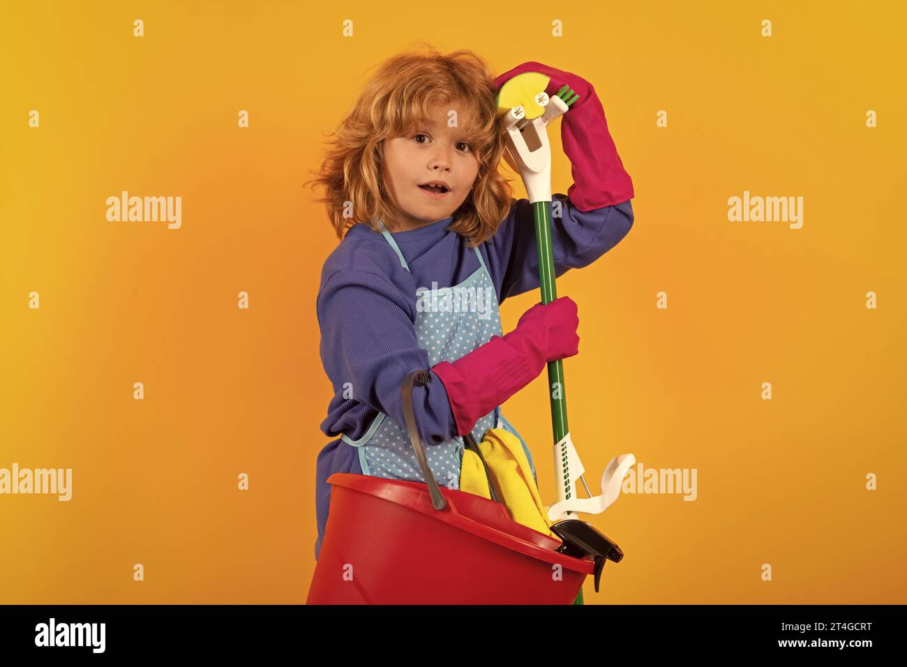 Cleaning house. Studio isolated portrait of child mopping house ...