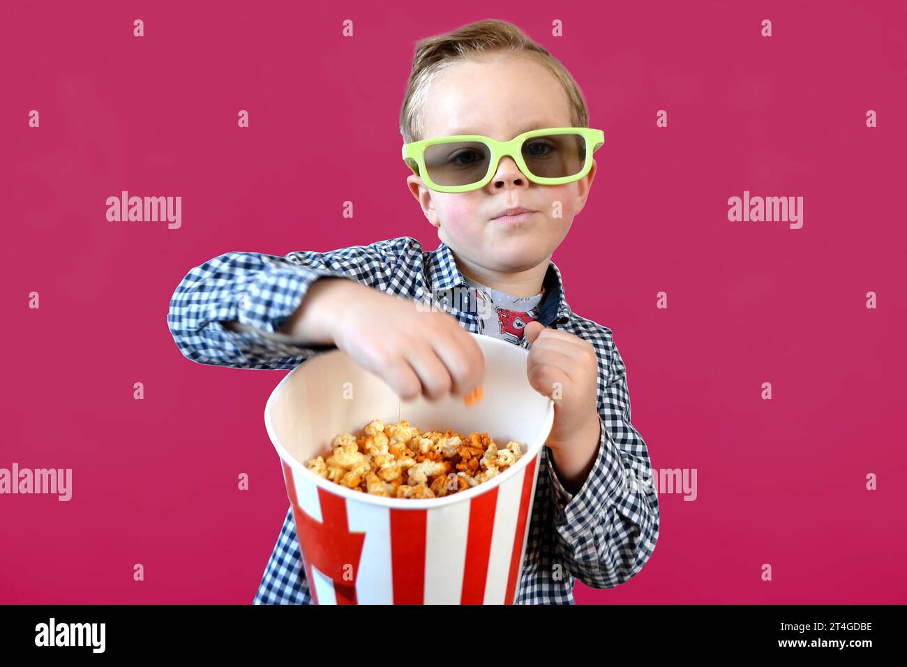 Cute fun kid baby boy 4 year old in red t-shirt holding bucket for ...