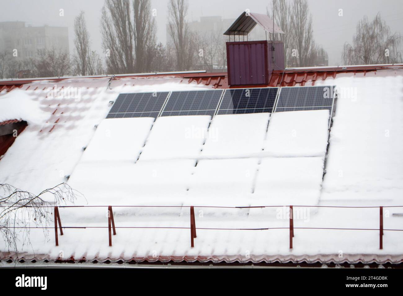 Solar panels covered by snow Stock Photo - Alamy