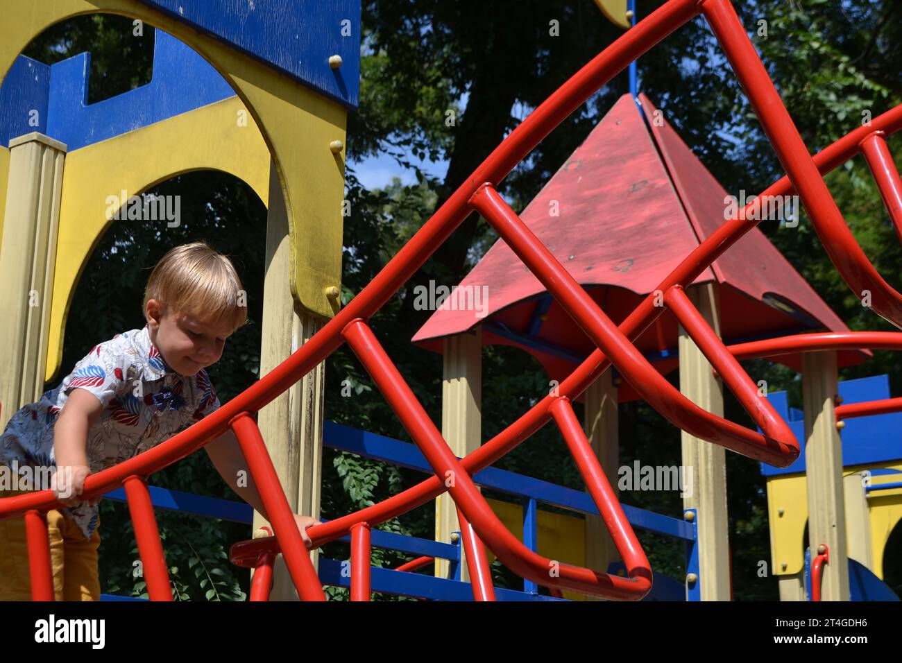 Little children run around and play in the playground Stock Photo - Alamy