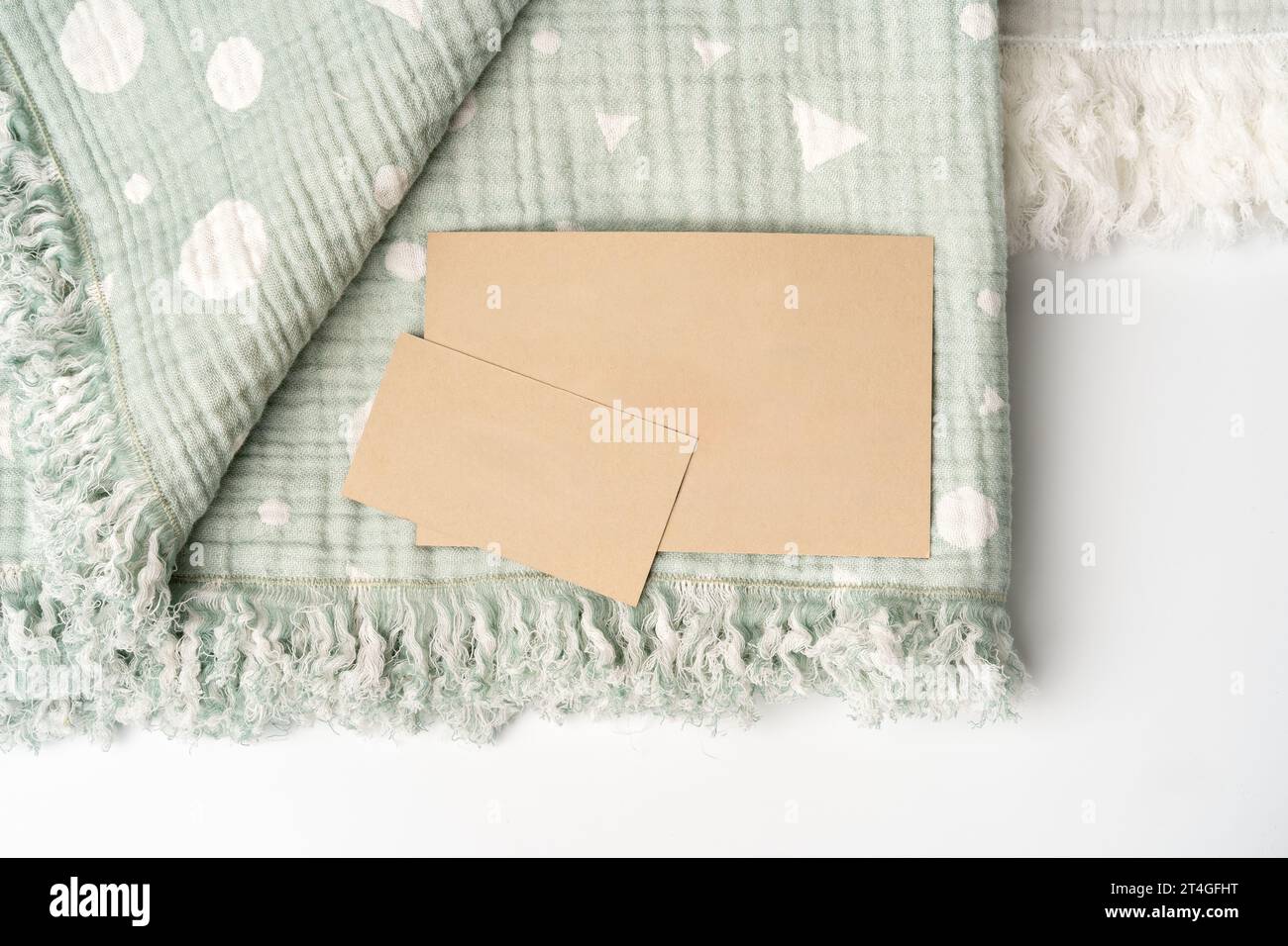 Warm cotton muslin blanket with paper tag on white background Stock ...