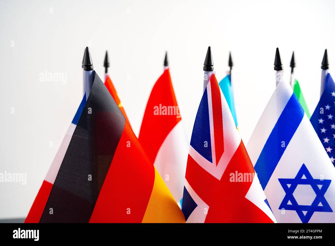 Lots of small national flags on table Stock Photo - Alamy