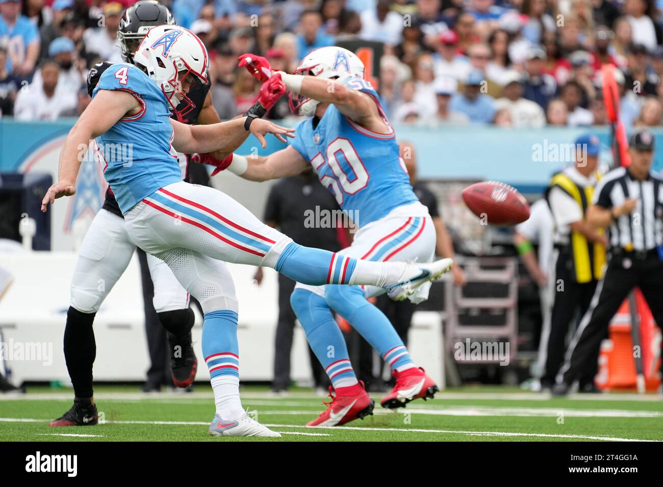 Tennessee Titans punter Ryan Stonehouse (4) punts against the Atlanta ...