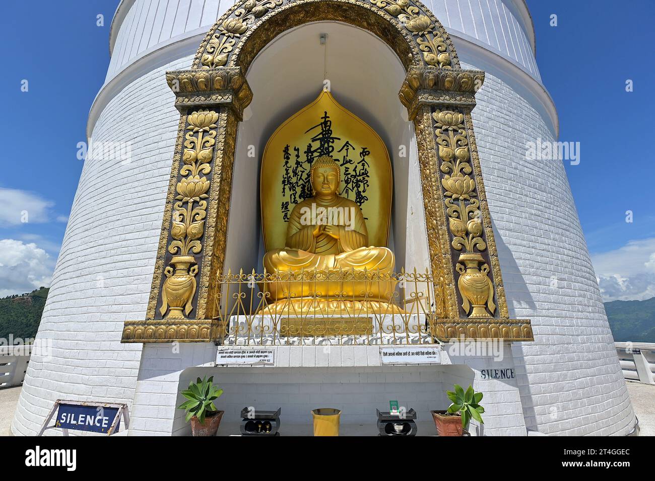 The Shanti Peace Pagoda in Pokhara, Nepal with seated Buddha image in ...