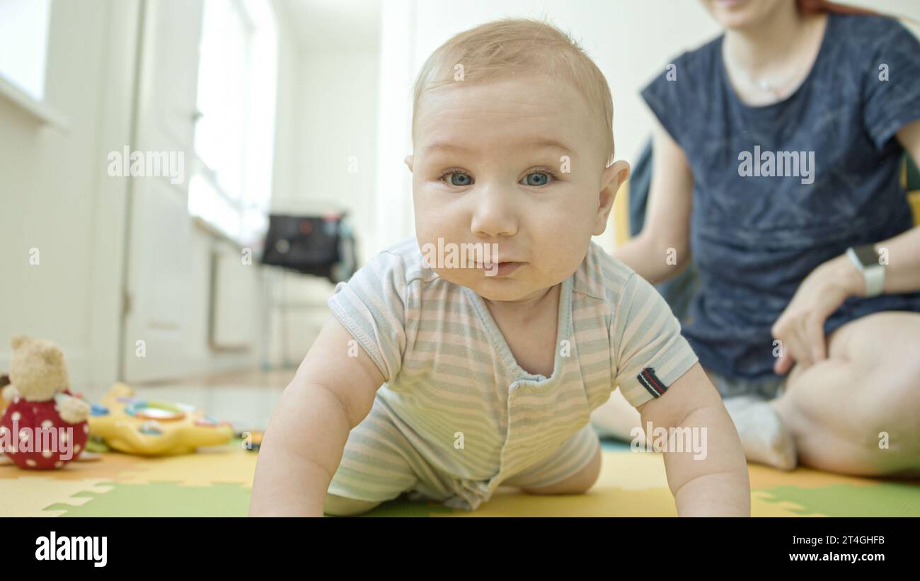 A little baby curious baby looking in the camera Stock Photo - Alamy