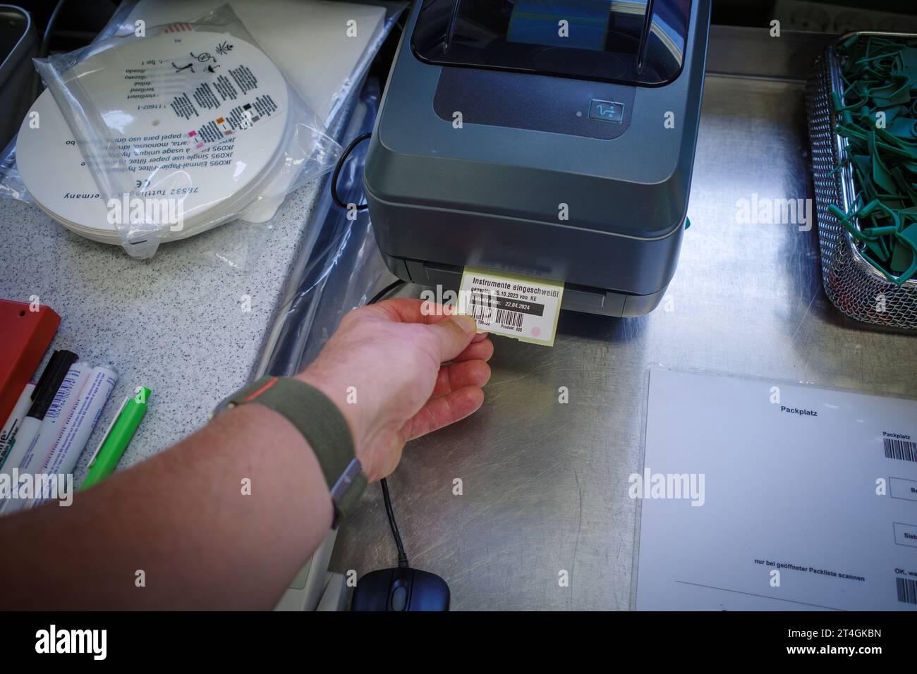 a label is pulled out of a label printer Stock Photo - Alamy