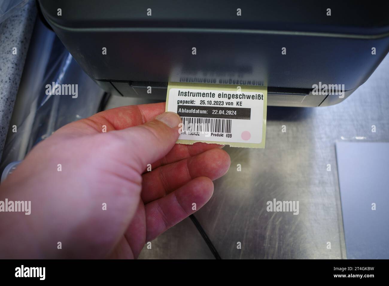 a label is pulled out of a label printer Stock Photo - Alamy