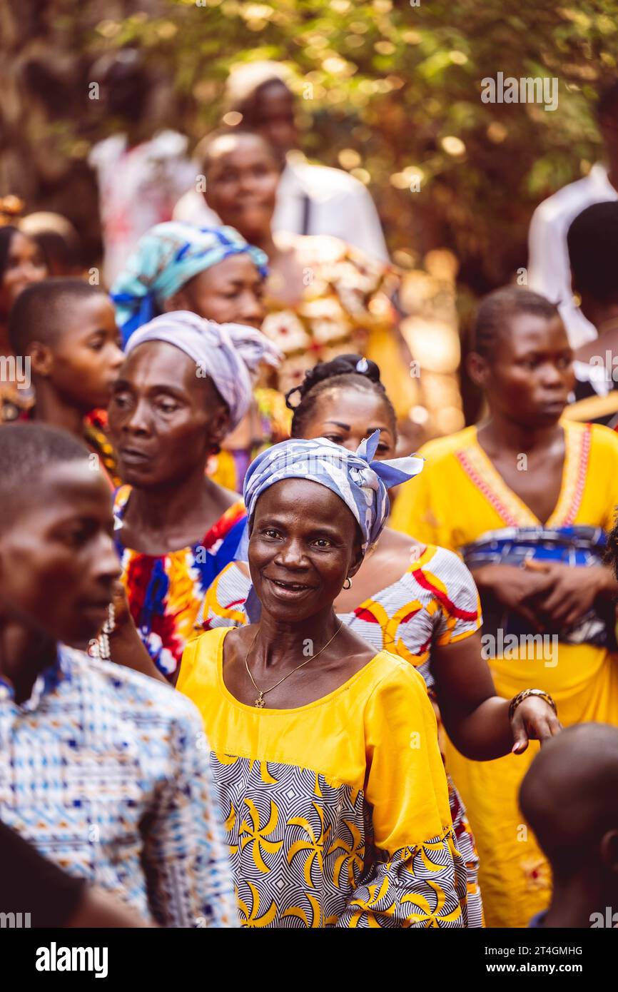 A group of people in Abidjan, Cote d'Ivoire wearing bright, vibrant ...