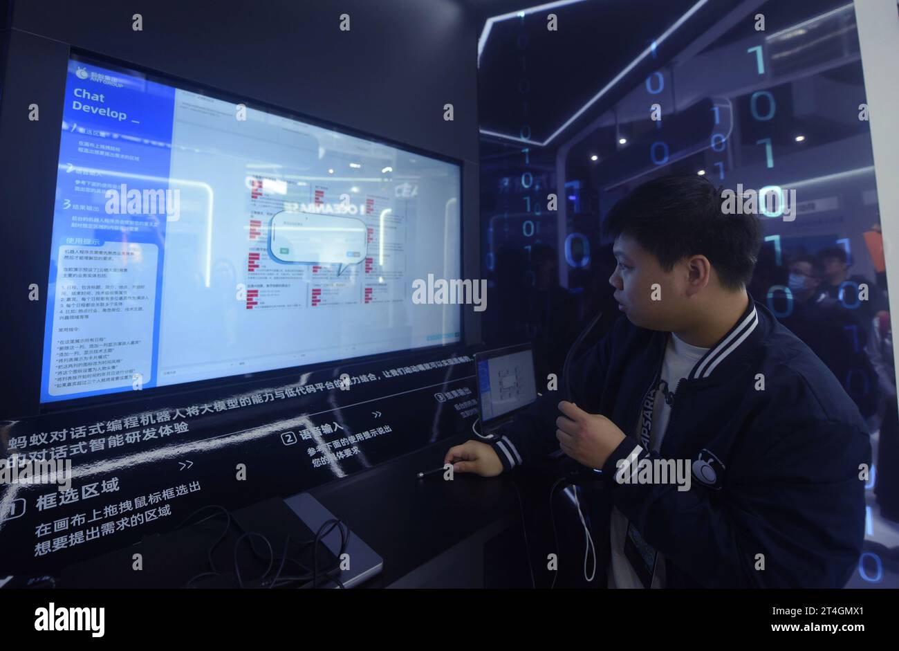 HANGZHOU, CHINA - OCTOBER 31, 2023 - A staff member introduces a ...