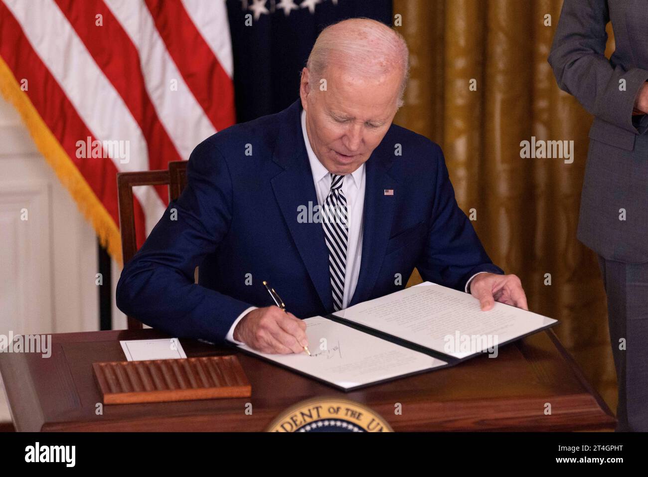 Washington, USA. 31st Oct, 2023. U.S. President Joe Biden signs an ...