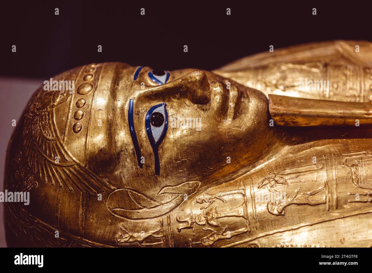 An ornate golden mummy displayed in an exhibit at the Egyptian Museum ...