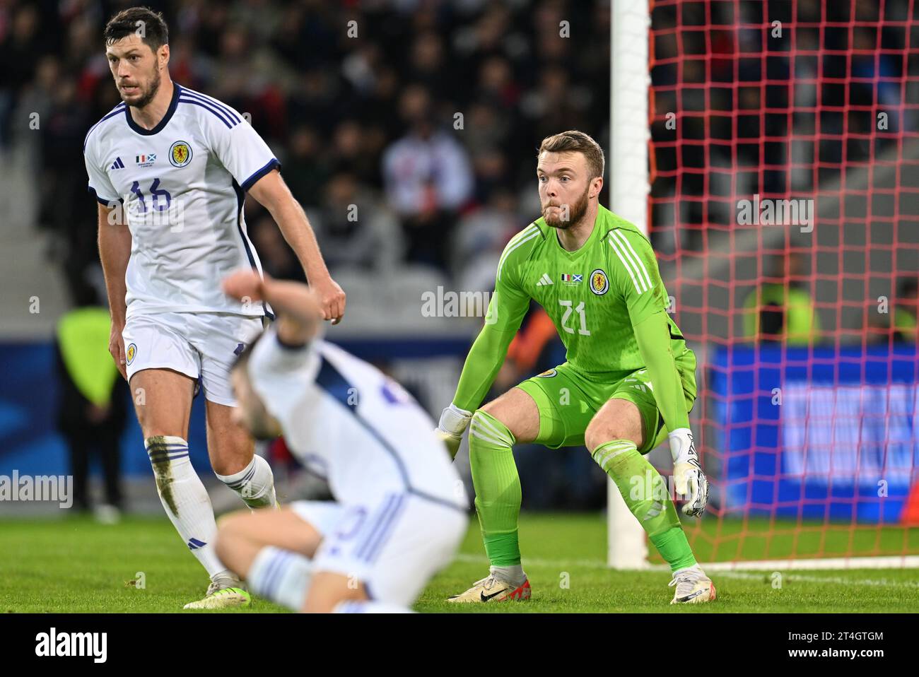 Scott McKenna (16) of Scotland and goalkeeper Zander Clark (21) of ...