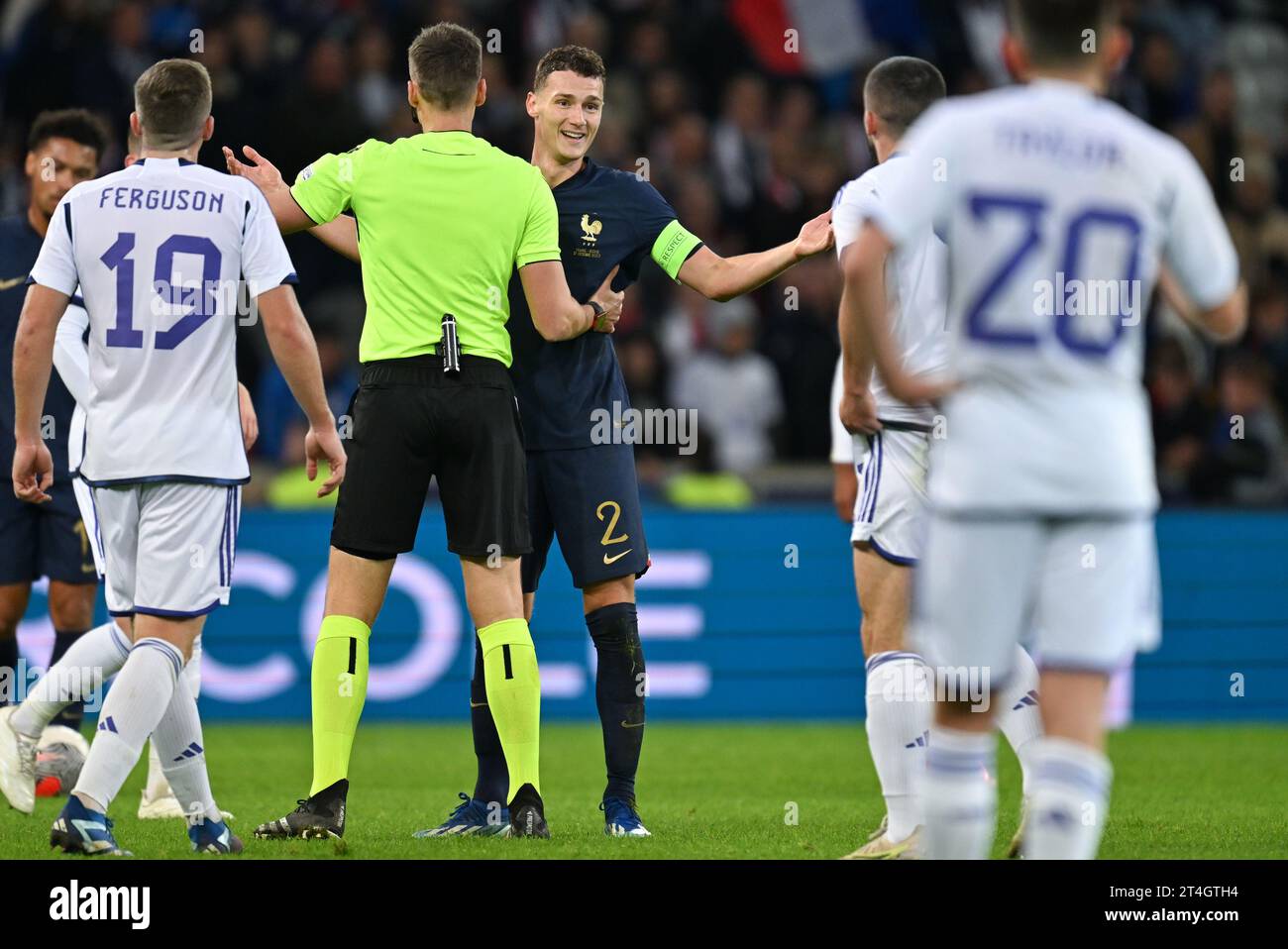 German referee Tobias Stieler pictured pushes back Benjamin Pavard (2 ...
