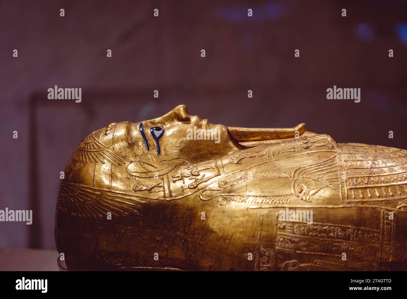 An ornate golden mummy displayed in an exhibit at the Egyptian Museum ...