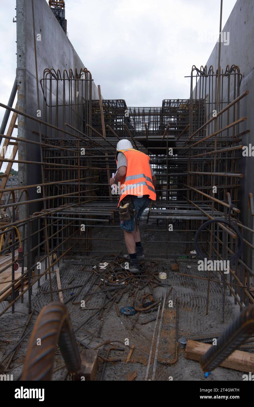 construction worker at a building site, employee in construction ...
