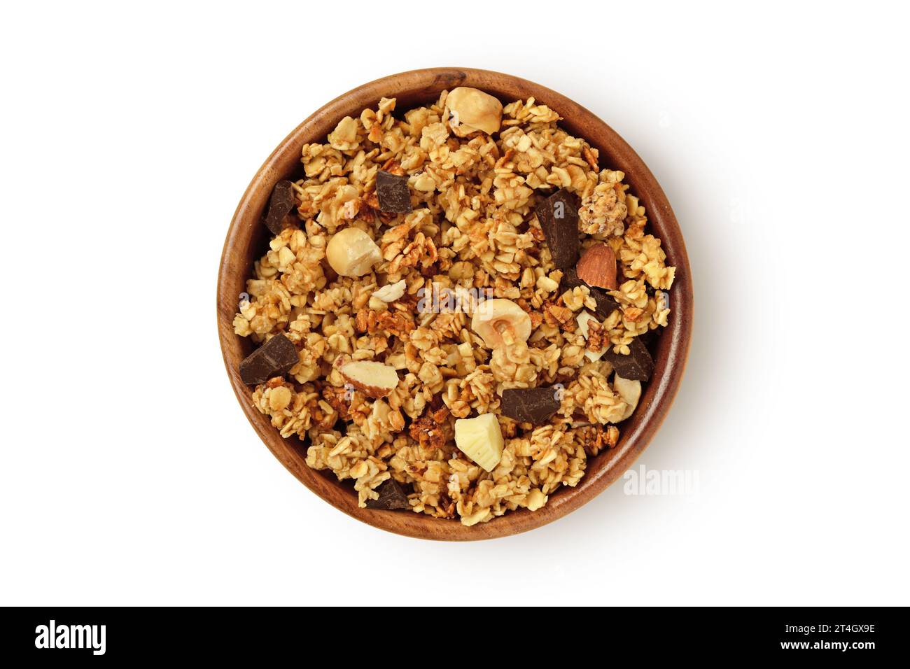 Homemade granola in wooden bowl on white background Stock Photo - Alamy