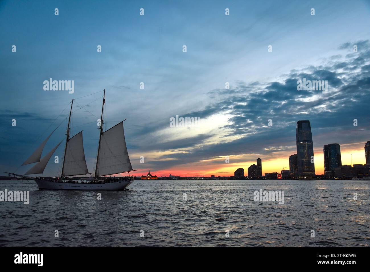 A Schooner Sailing through Hudson River at Dusk with Jersey City ...