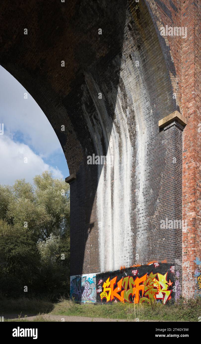 Graffiti on an arch of the victorian brick built railway viaduct ...