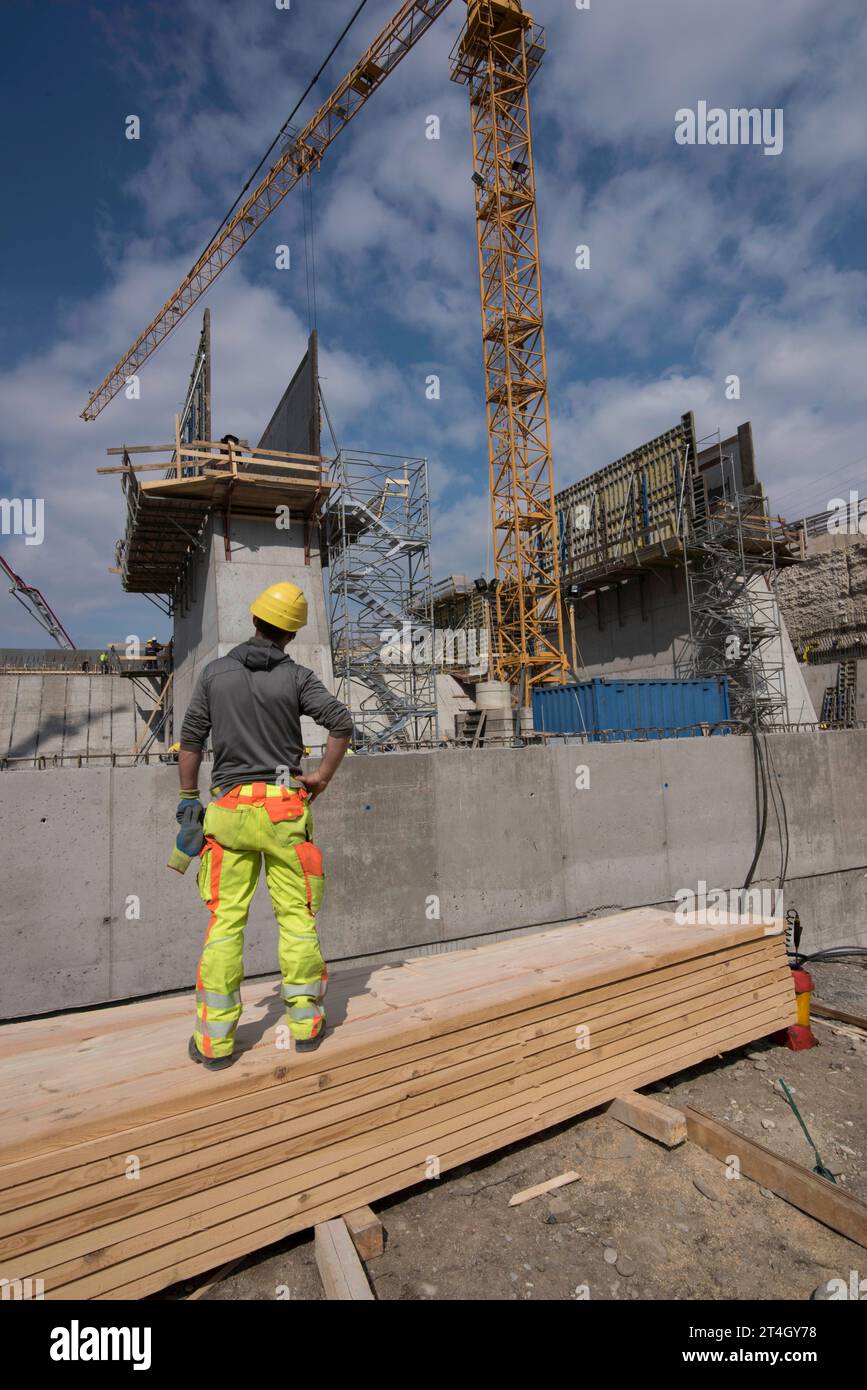 Construction Worker At A Building Site, Employee In Construction ...