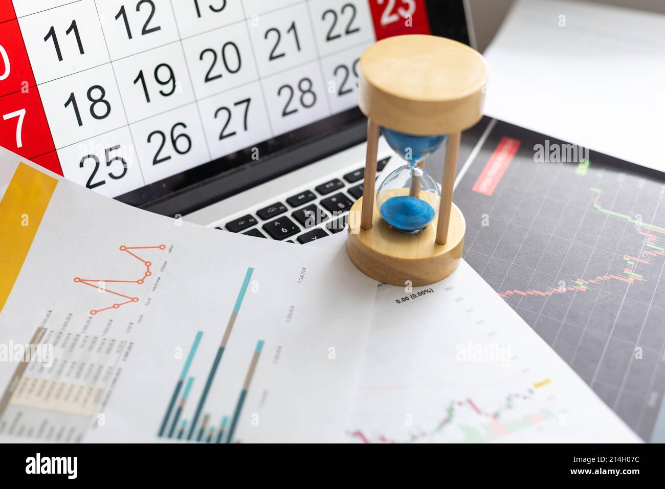 Hour glass on calendar with thumbtacks concept for time slipping away ...