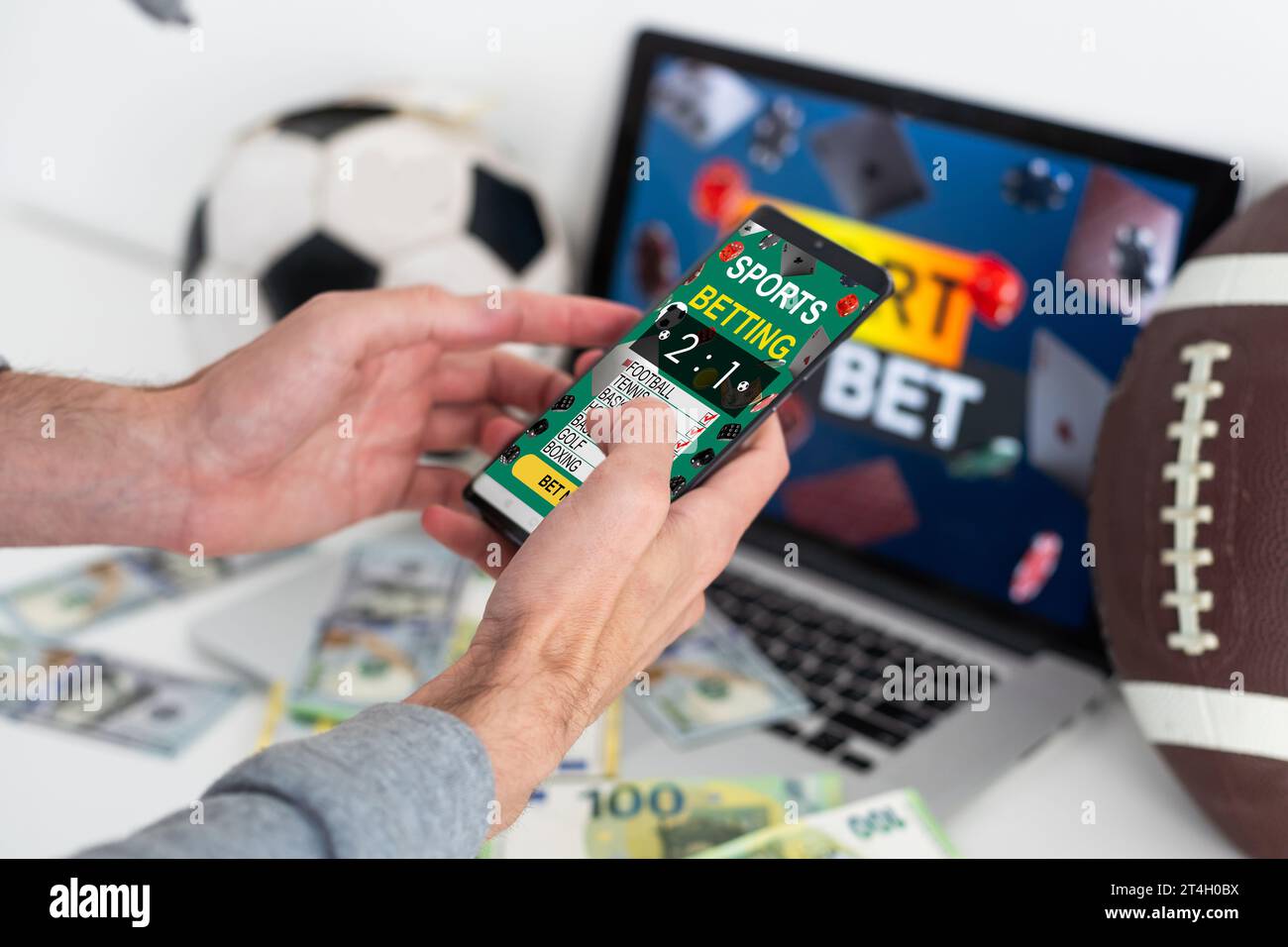 Smartphone with victory message and male's hand with soccer ball. Sport ...