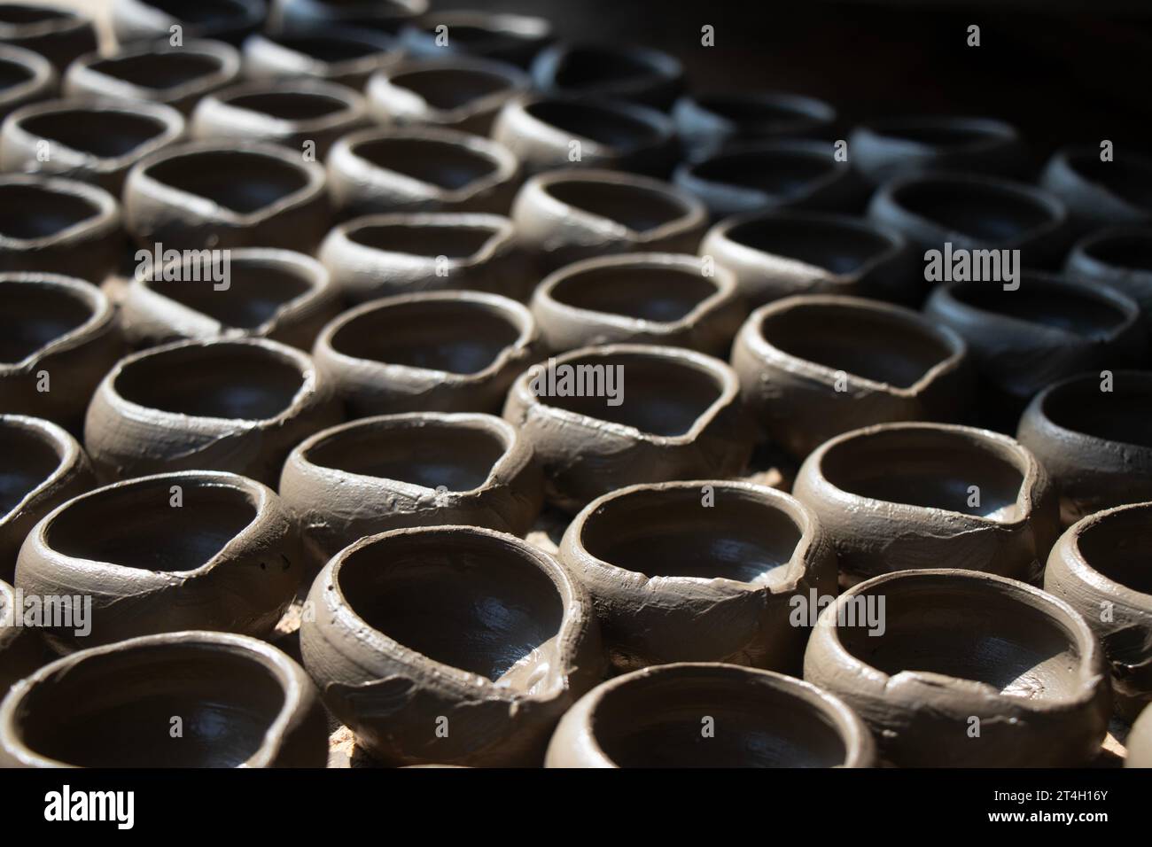 hand made clay lamps, diya, deep kept in sunrise to dry Stock Photo - Alamy