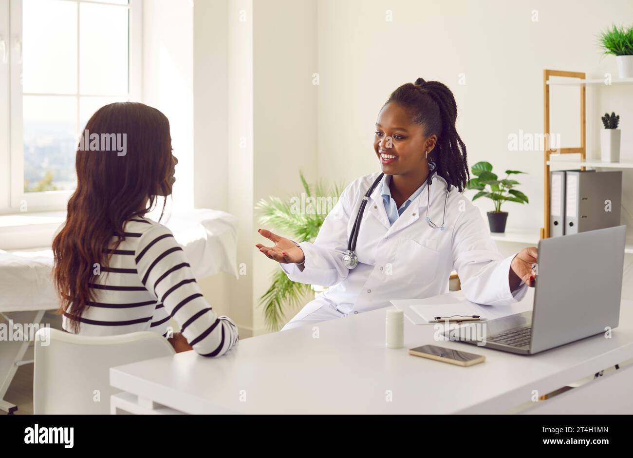 Doctor visiting african american hi-res stock photography and images ...