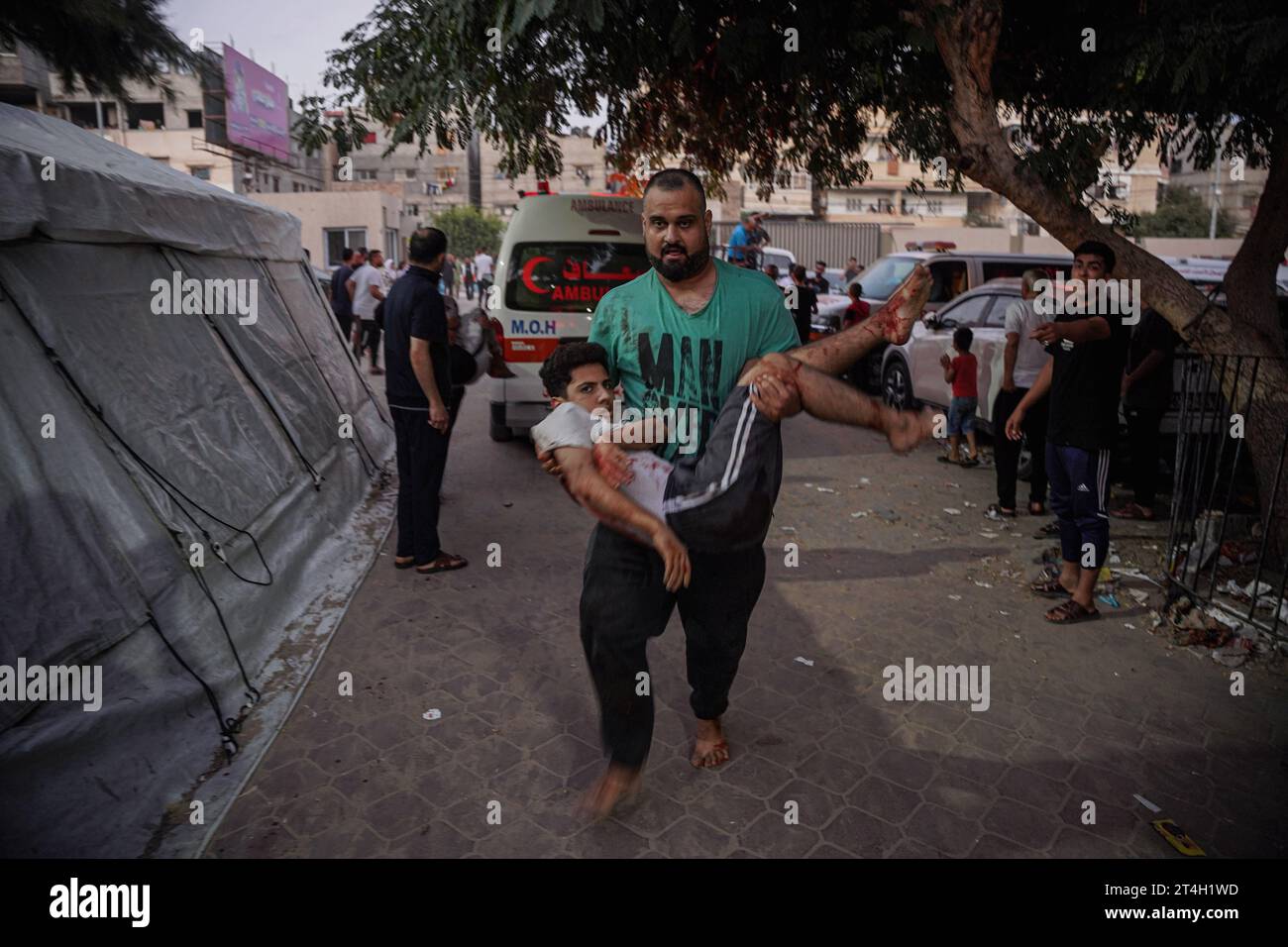 Gaza, Gaza, Palestine. 30th Oct, 2023. A father carries his child and ...