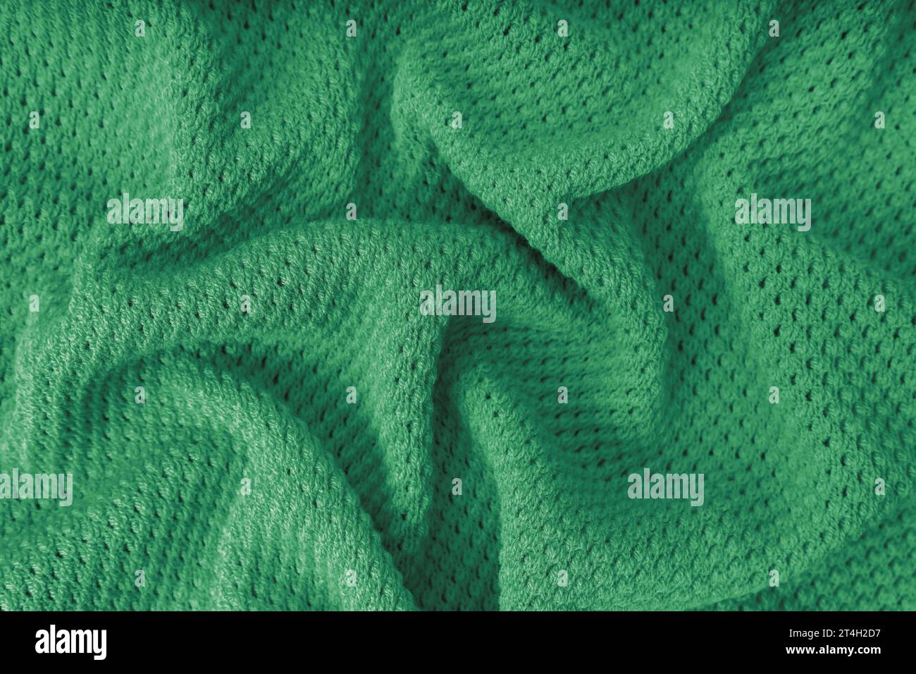 Green color crumpled, wrinkled knitting wool cloth texture. Background ...
