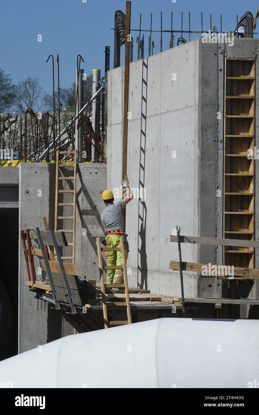 Construction Worker At A Building Site, Employee In Construction ...