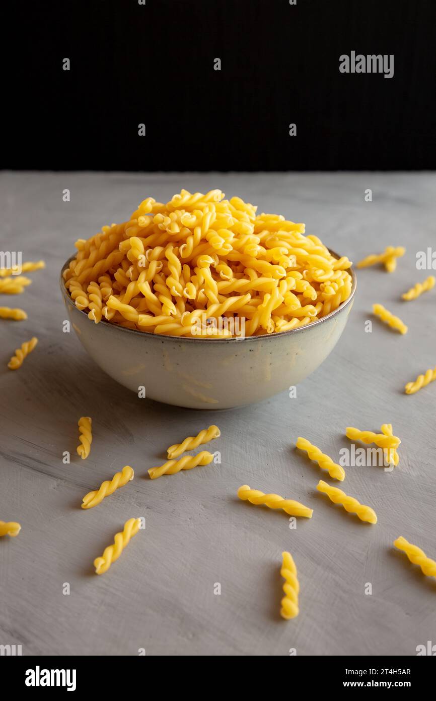 Uncooked Dry Gemelli Pasta in a Bowl, side view Stock Photo - Alamy