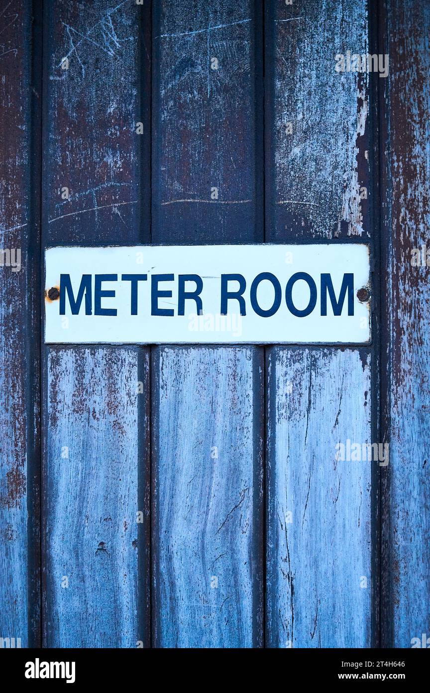 Wooden door leading to meter room Stock Photo - Alamy