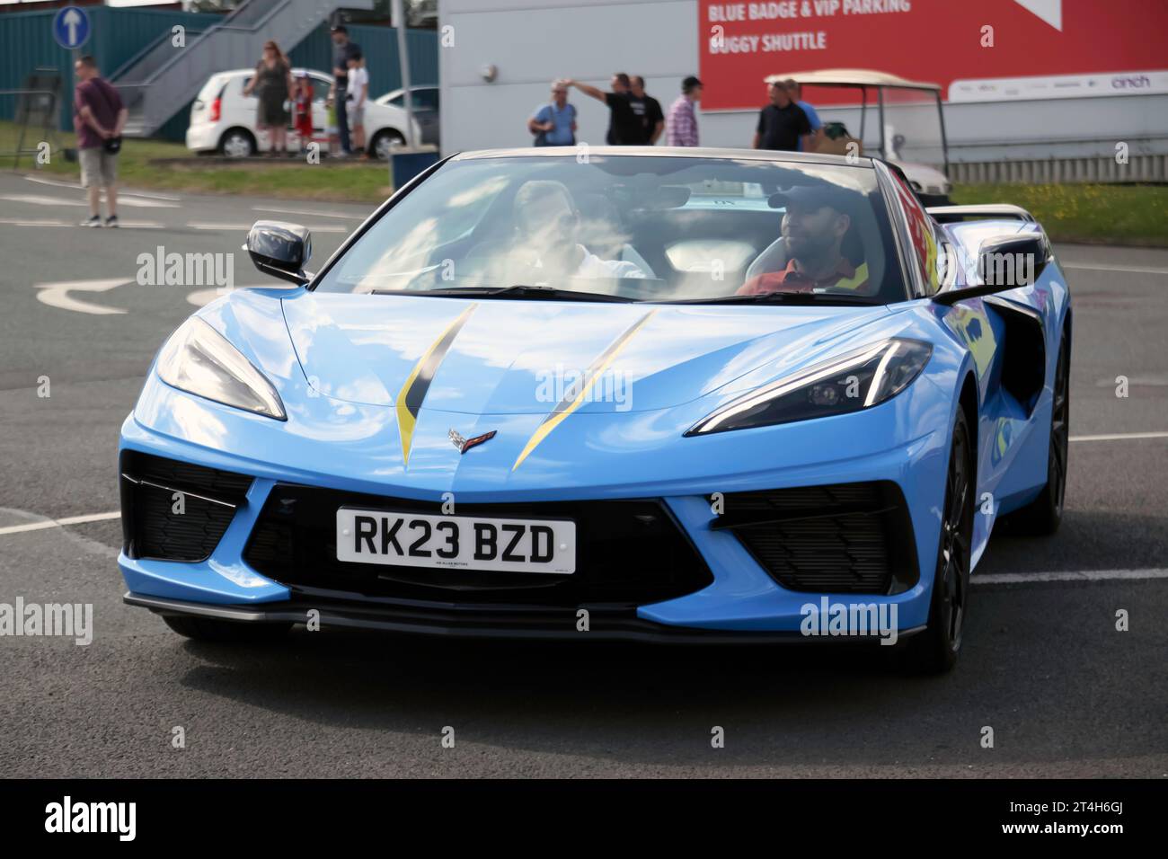 Front view of a Blue, 2023, Chevrolet Corvette C8, about to enter the ...