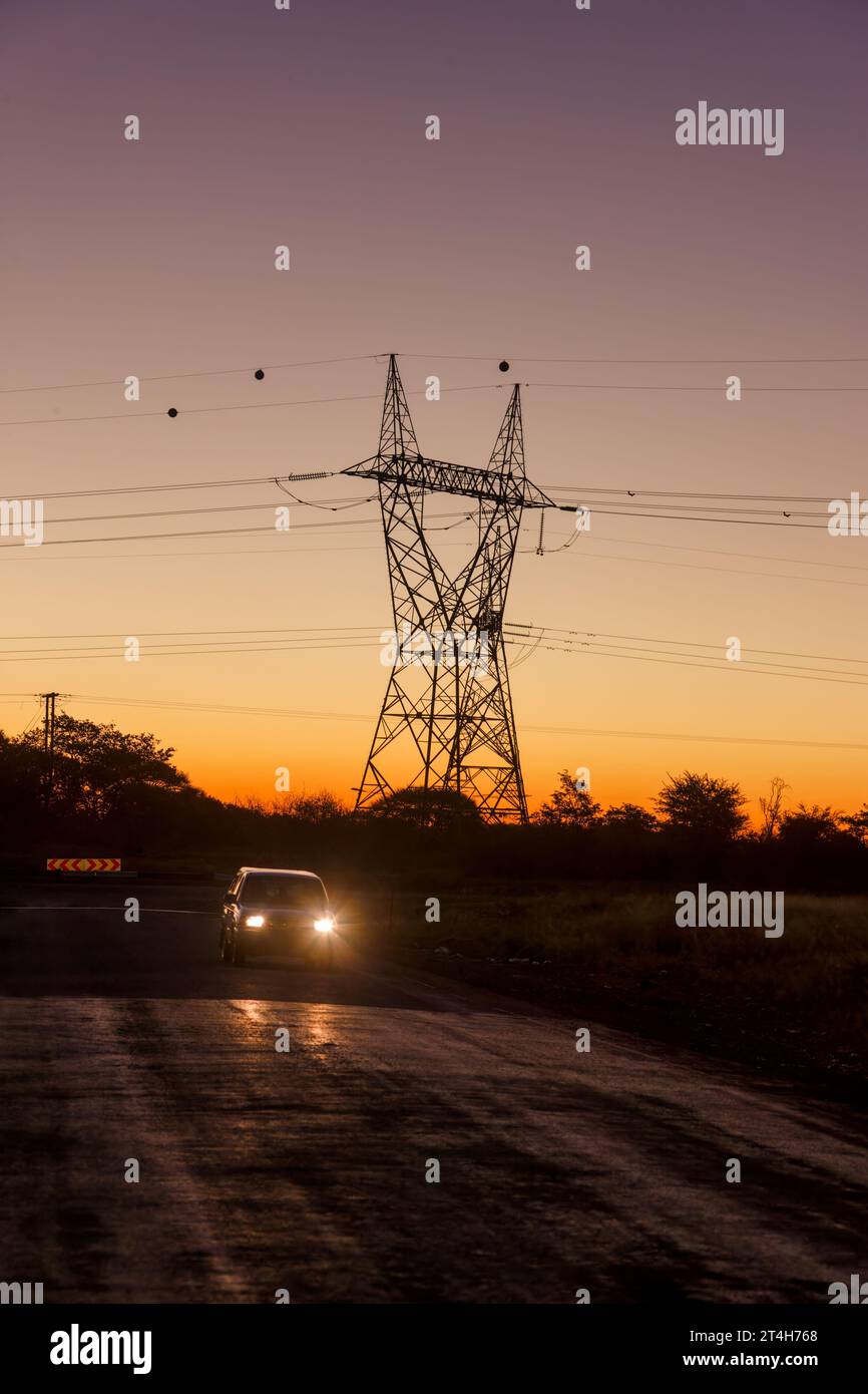 night driving a car, electricity high voltage pole in the background ...