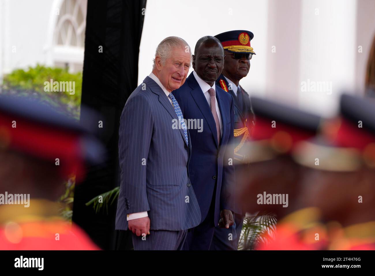 Britain's King Charles III, left, and Kenya's President William Ruto, center, attend a welcome ...