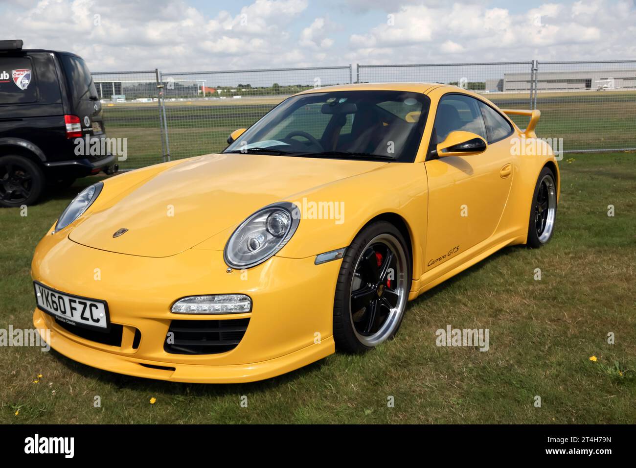 Three-quarters Front View of a Yellow, 2011, Porsche 991 (997), Carrera ...