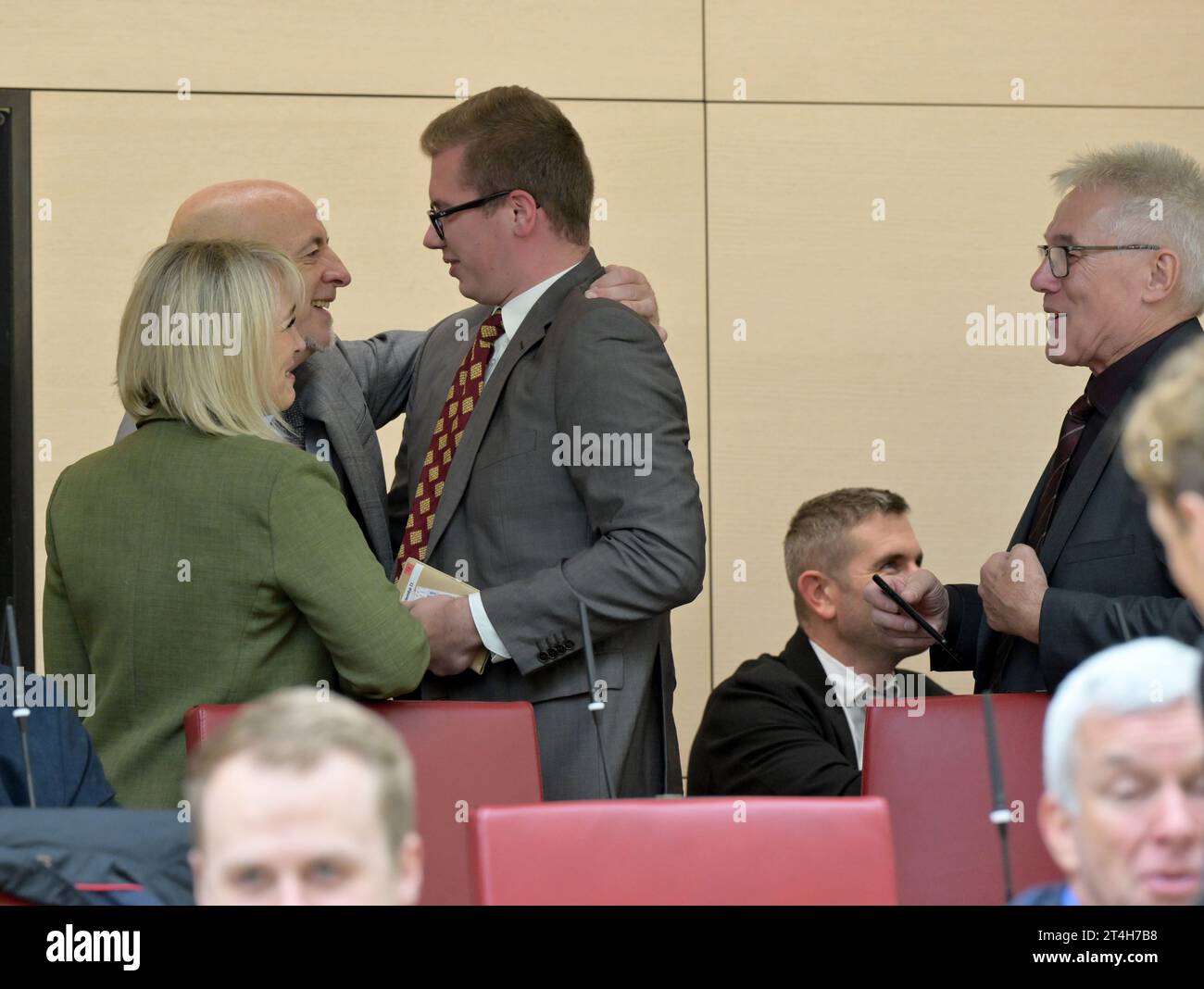 Munich, Germany. 31st Oct, 2023. Daniel Halemba (M, AfD) is greeted by ...