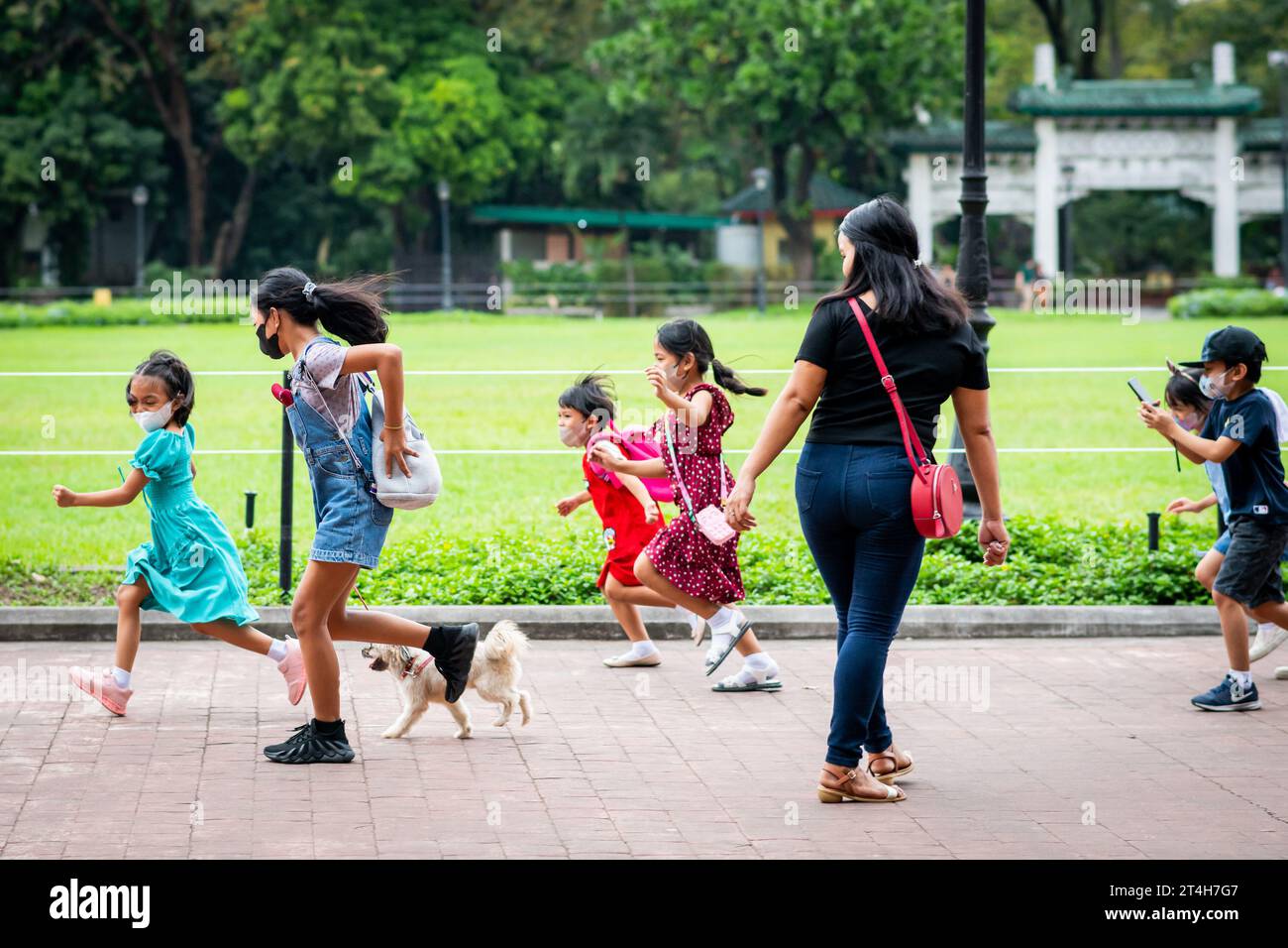 Children at play running through Rizal Park, Ermita, Manila, The ...